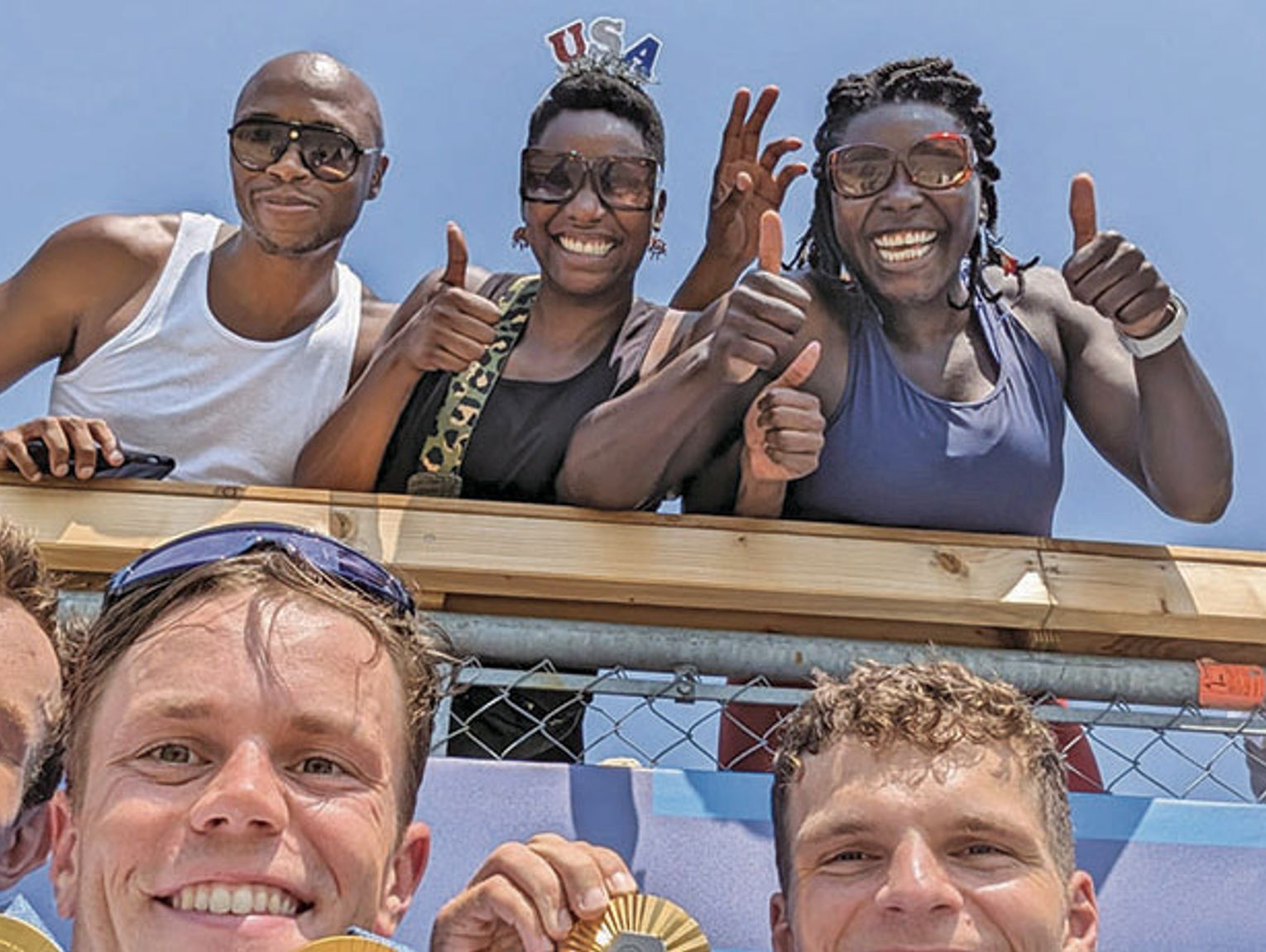 Columbus class of 99’ graduate all smiles with U.S. Olympic gold medalists