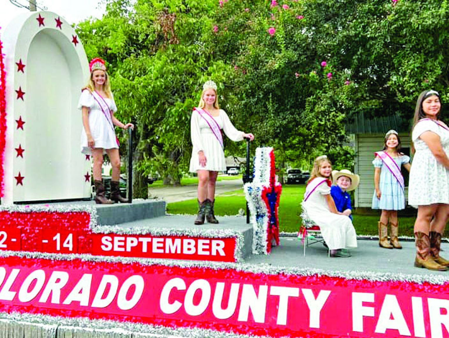 FAIR QUEENS SHOW FACE AT FAYETTE COUNTY FAIR PARADE